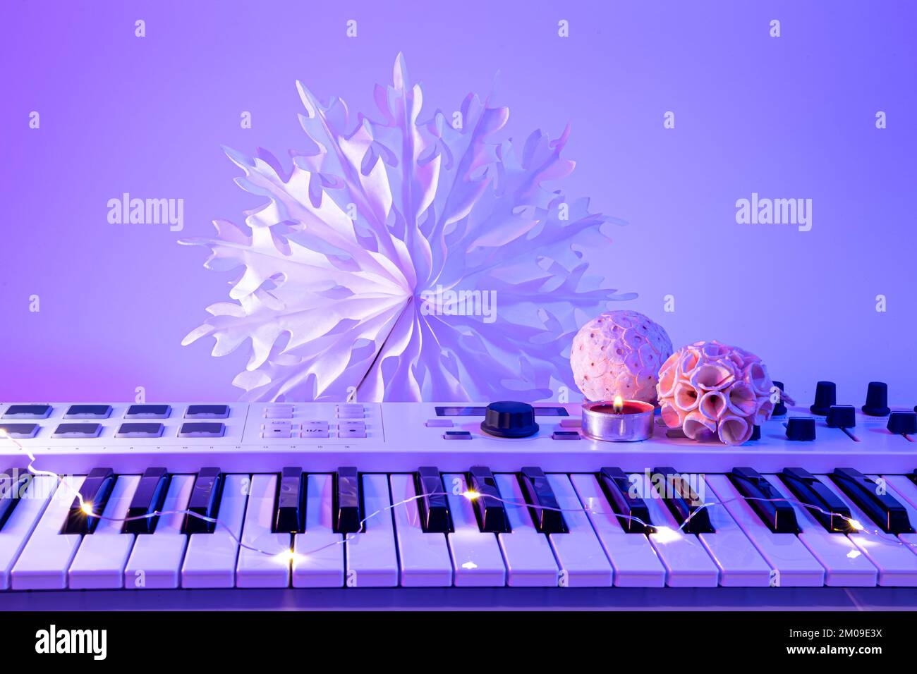 Christmas background with midi keyboard and holiday decor with neon ...