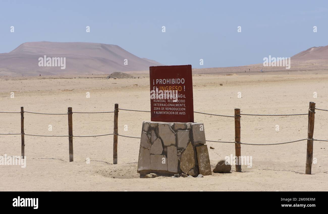 Sign and rope barrier at the boundary of Paracas National Reserve ...