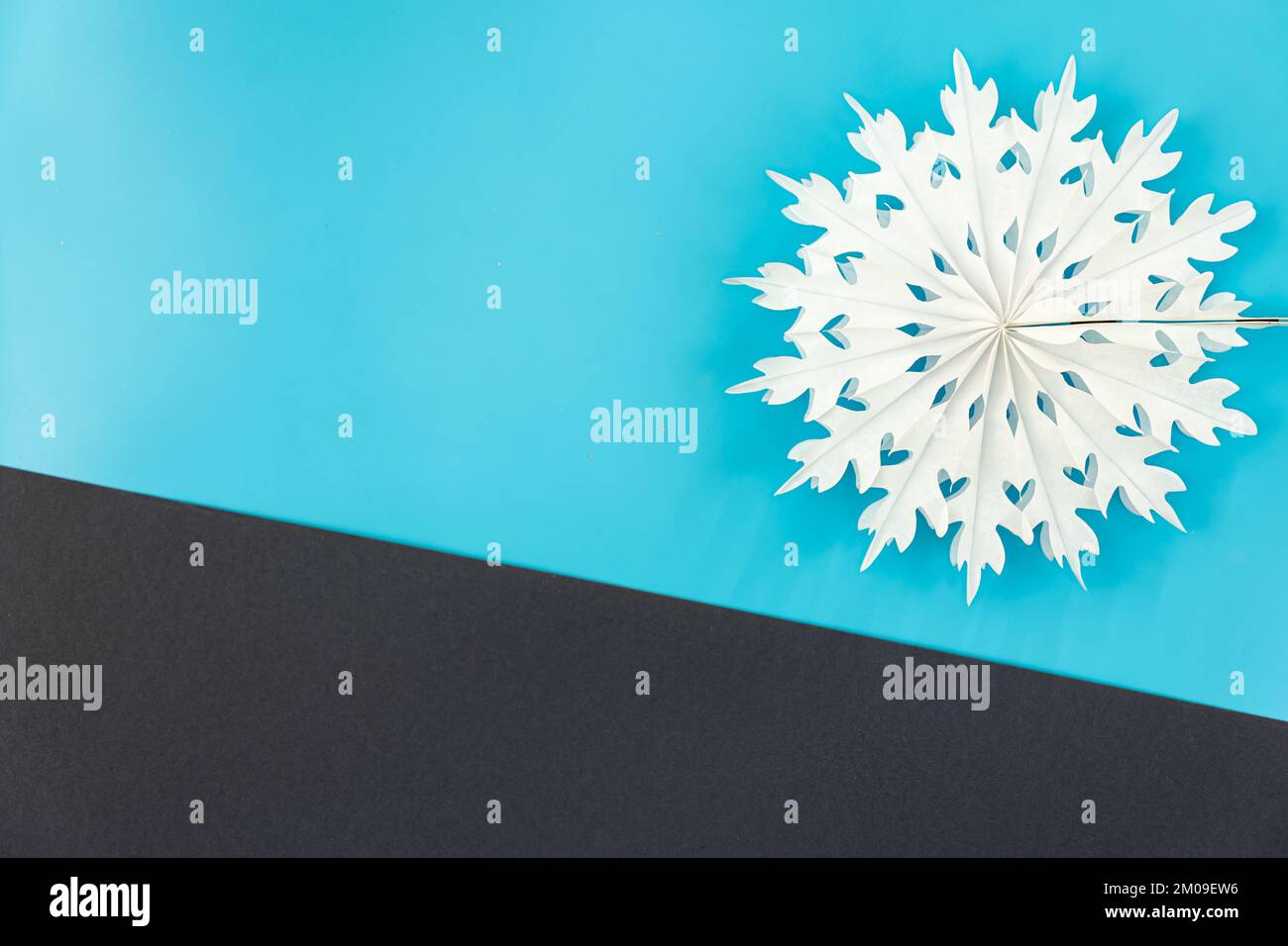 Volumetric paper snowflake on a colored background, flat lay Stock ...