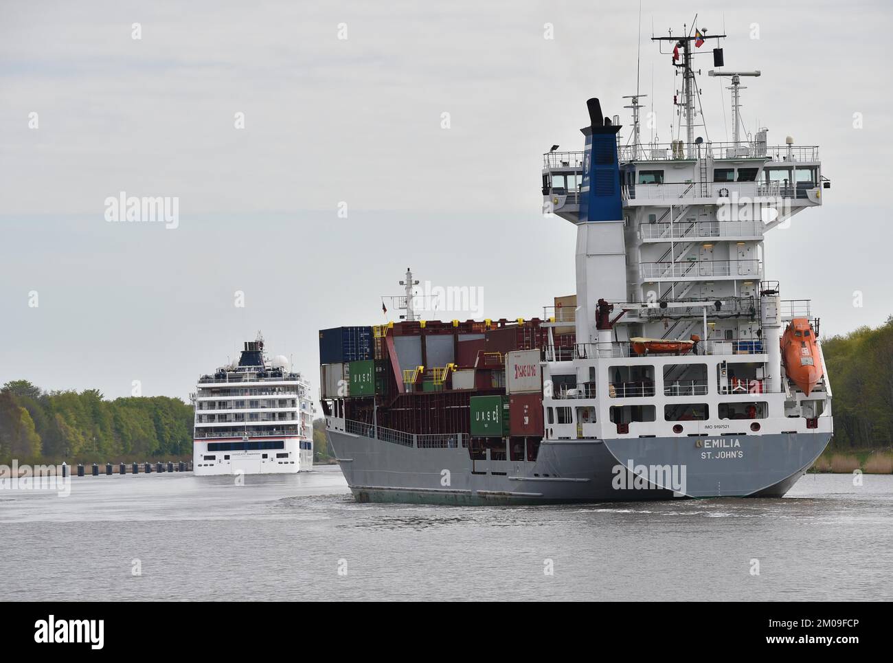 Cruise ship Hanseatic Inspiration and container ship on voyage through ...