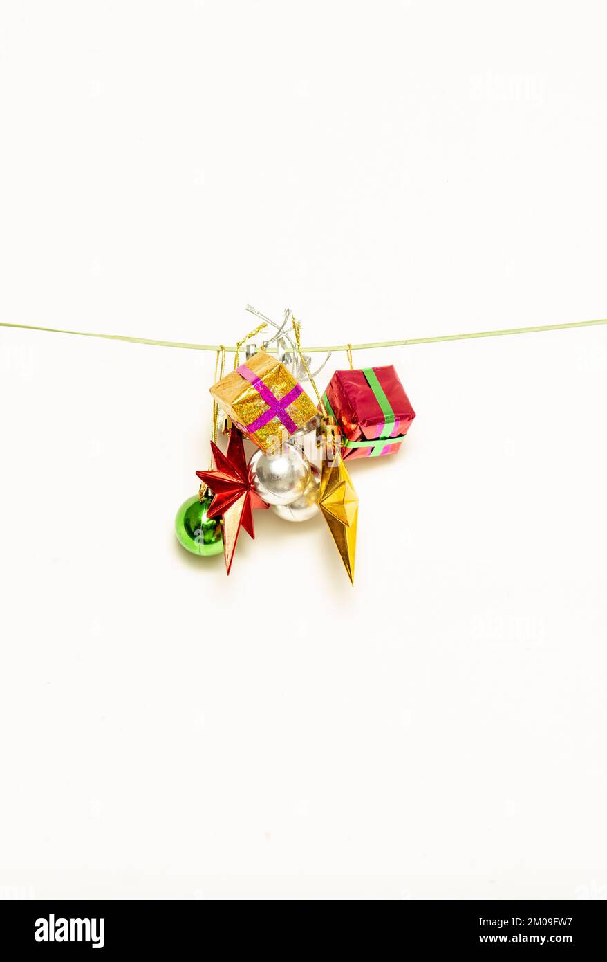 Christmas gifts are hanging on isolated white background Stock Photo ...