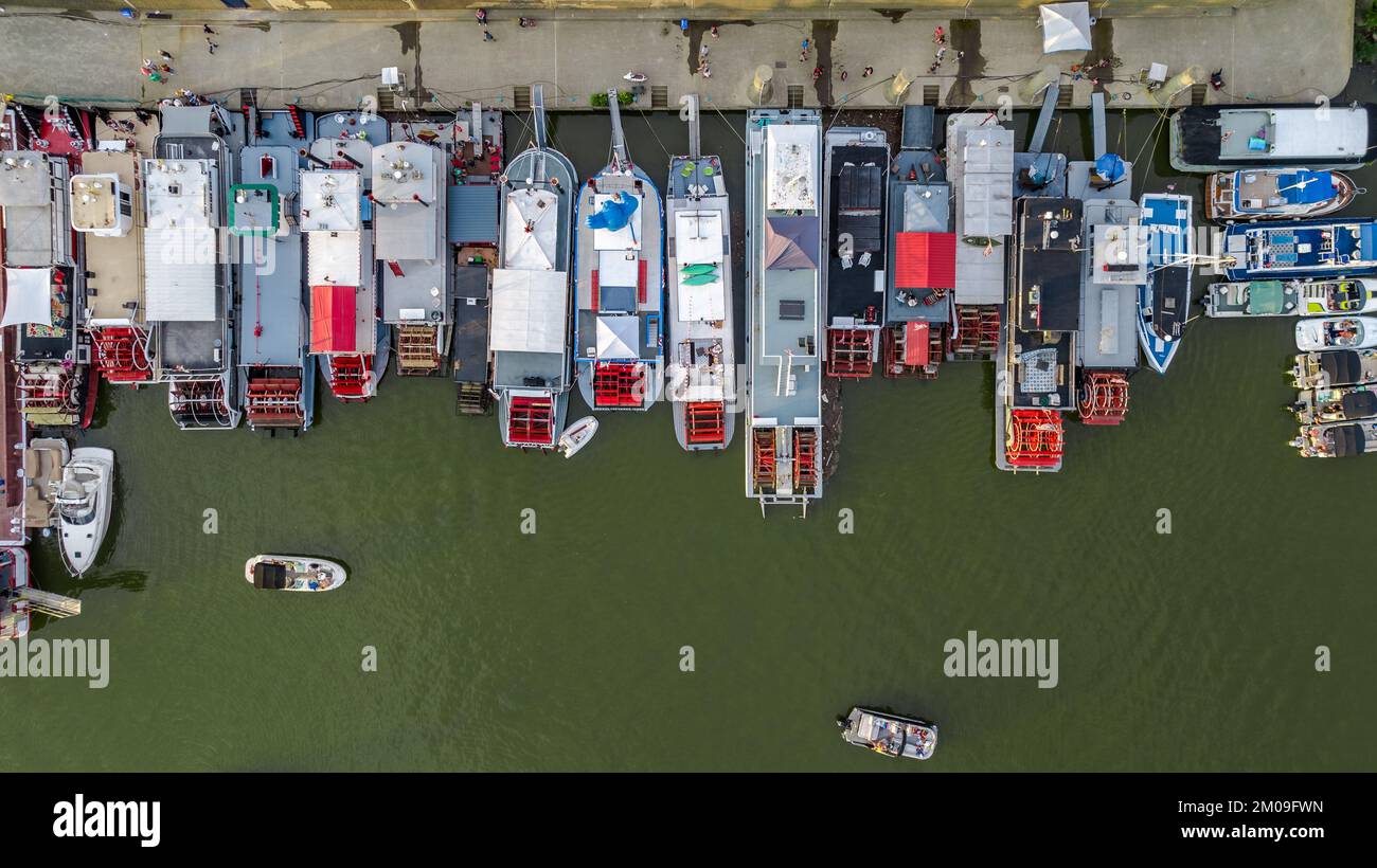 An aerial of several sternwheel boats docked along Haddad riverfront ...
