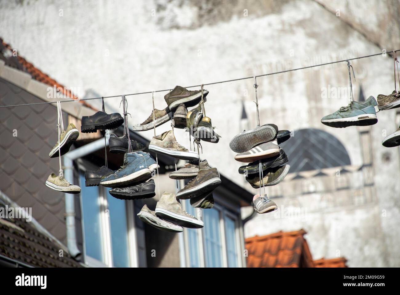 Shoes on a leash, street art called Shoefiti, Flensburg, Schleswig ...