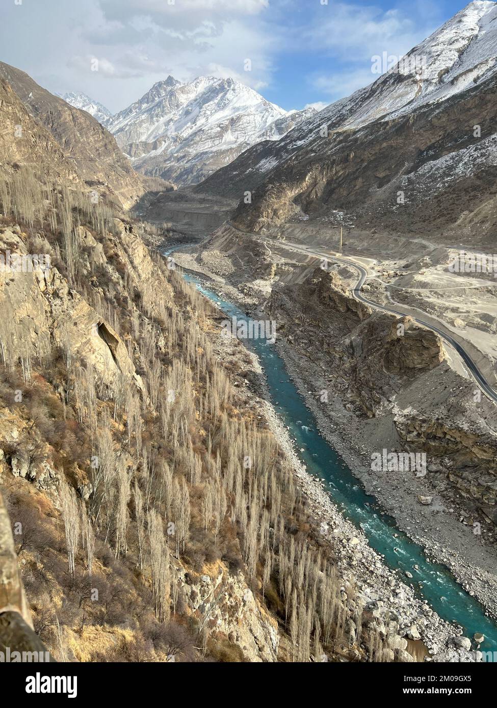 A vertical aerial view of Hunza River flowing in dry rocky valley in ...