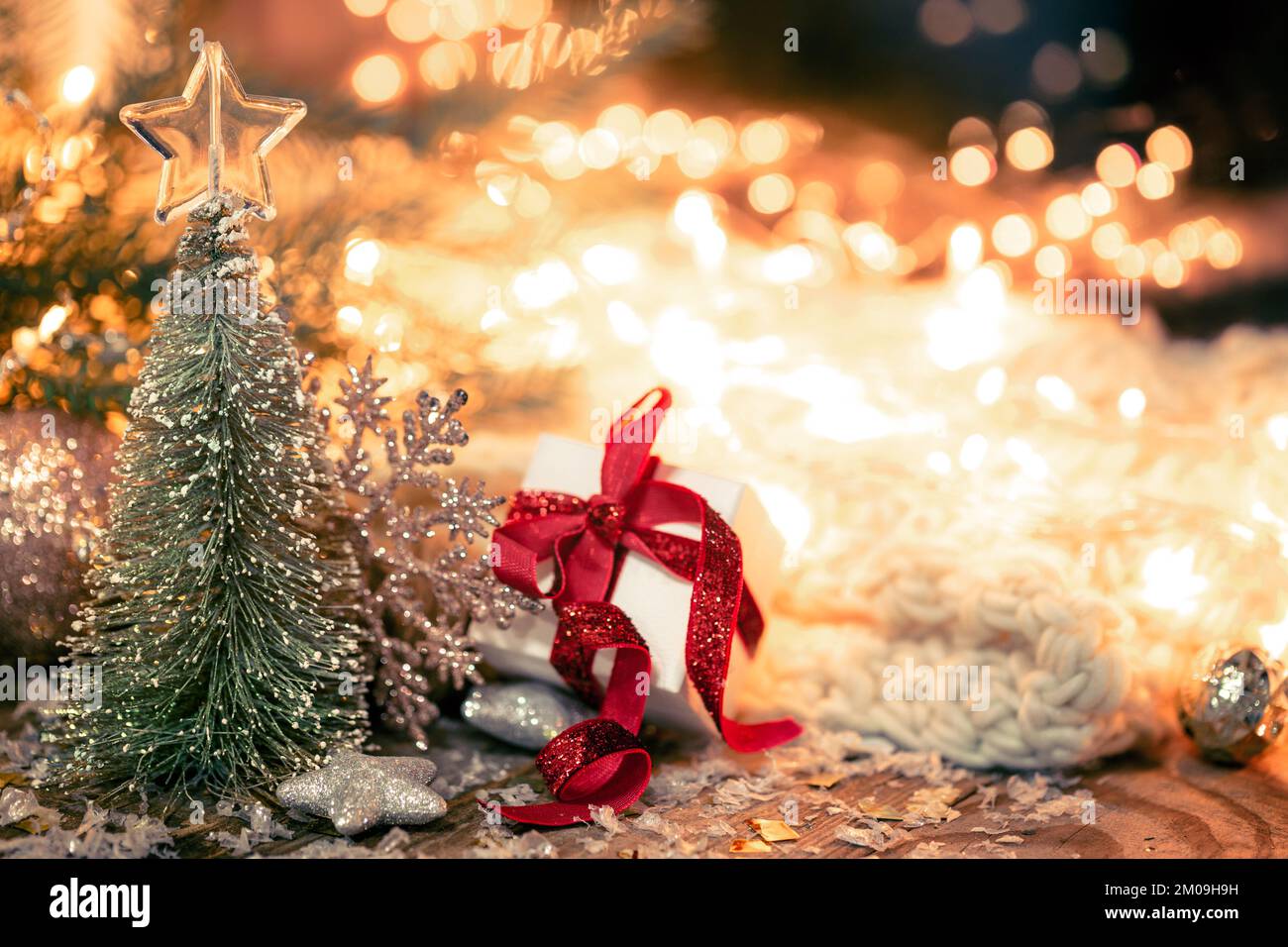 Christmas composition with a decorative tree and a gift box Stock Photo ...