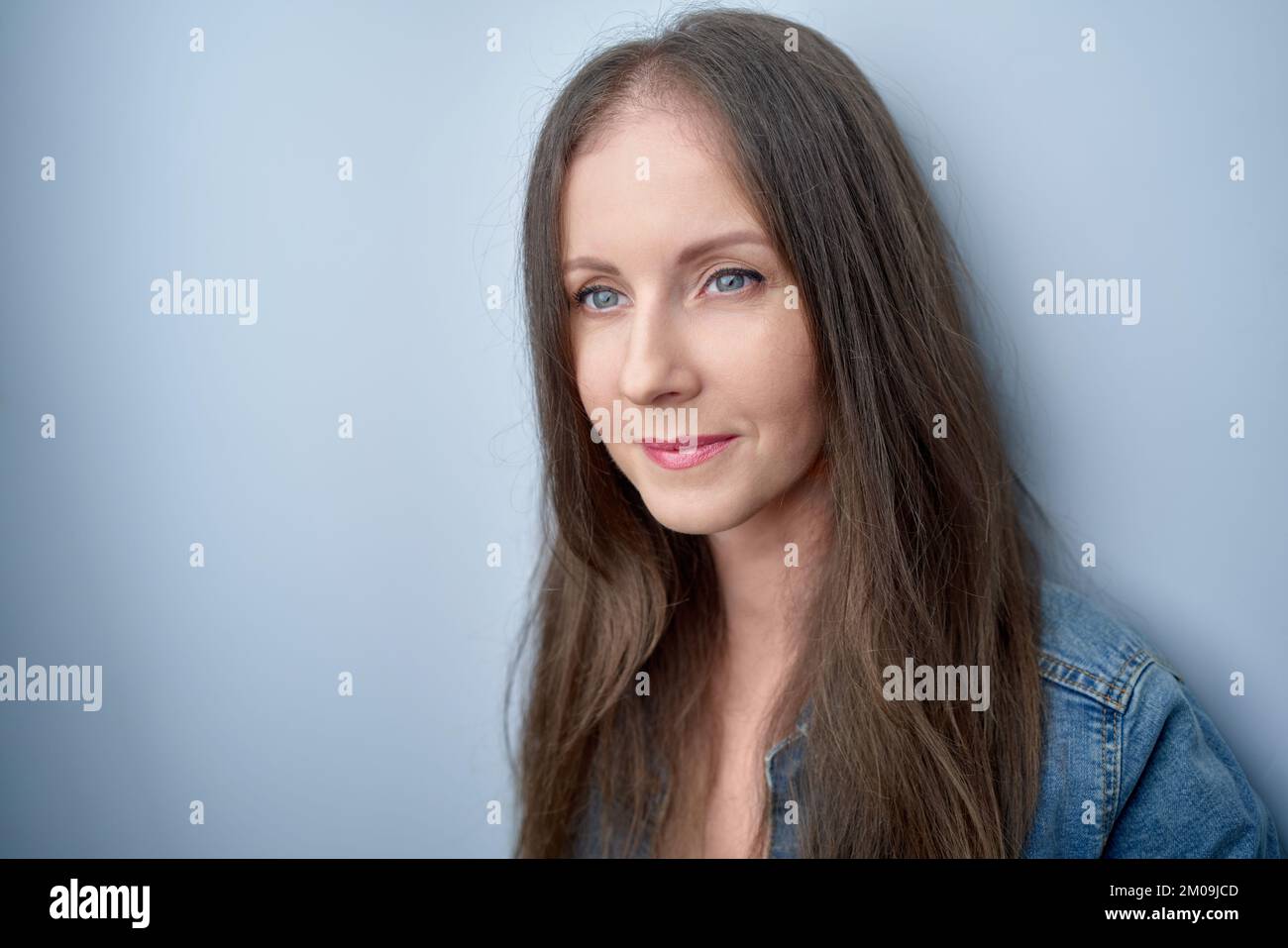 Portrait of happy smiling woman in casual. Young woman in 30s with ...