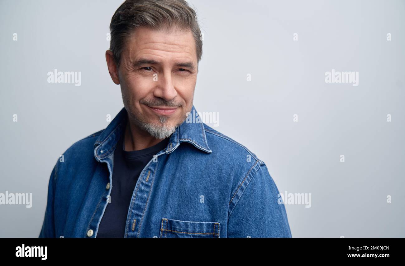 Portrait of happy smiling older man thinking with gray hair in casual ...