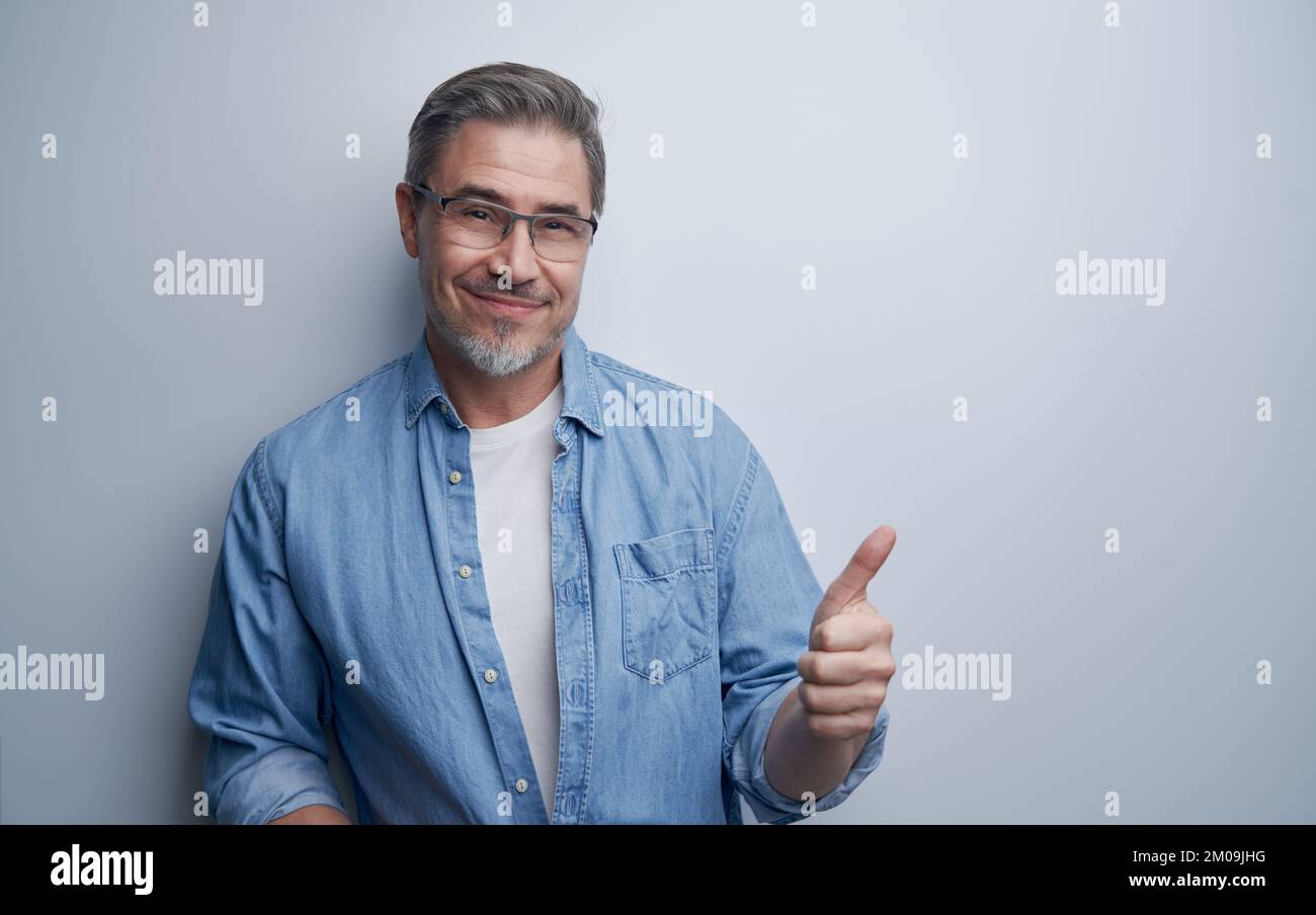 Portrait of mature age, middle age, mid adult casual man in 50s, happy ...