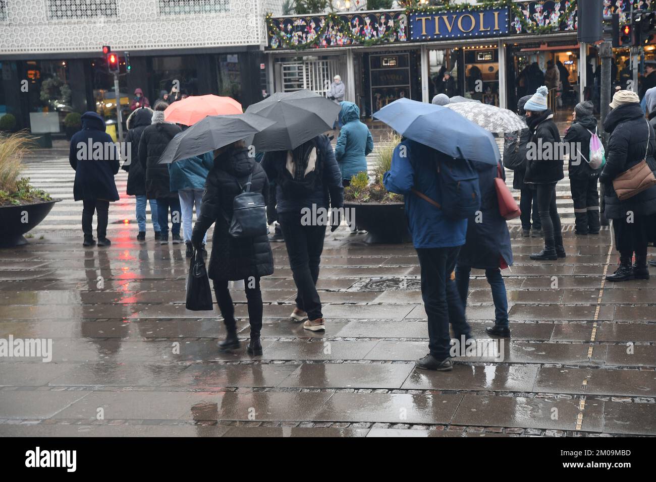 Copenhagen/Denmark/05 December 2022/ People under umbrella due to overy ...