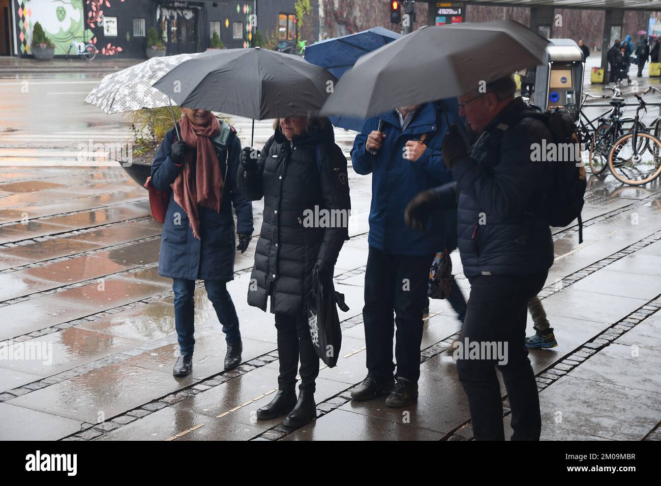 Copenhagen/Denmark/05 December 2022/ People under umbrella due to overy ...