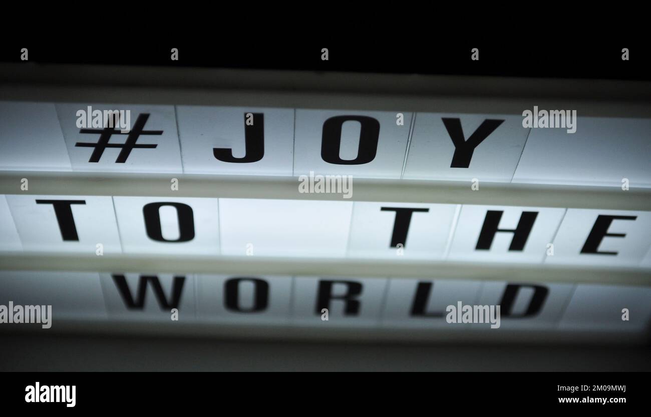 Light box with the phrase, "# Joy to the world" illuminated on it set ...