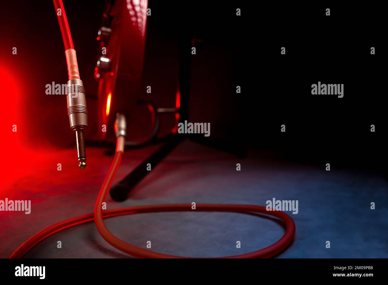 guitar pulled from the ground on the stage and the jack cable connected ...