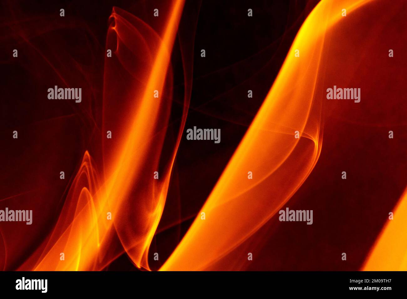 A wallpaper of red fire flames smoke against the black background Stock ...