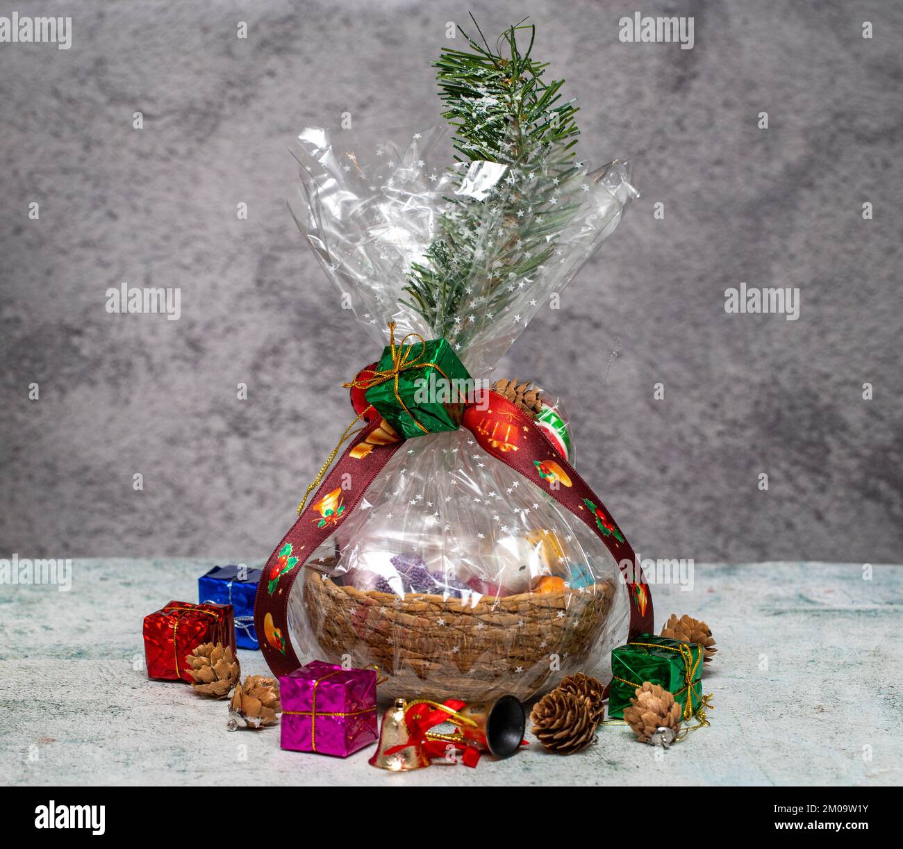 New Year gift. Christmas gift with basket on gray background. Package ...
