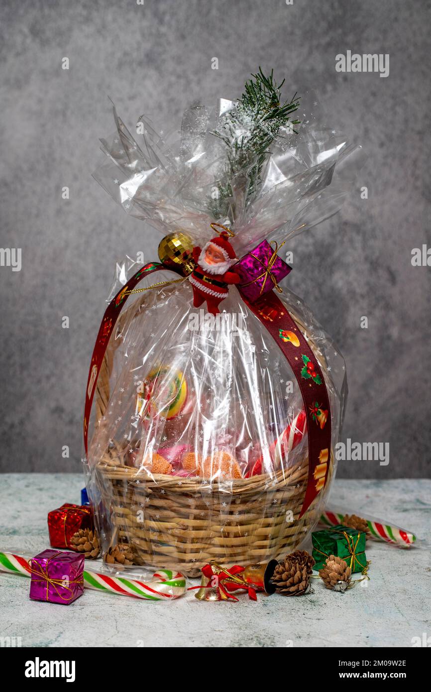 New Year gift. Christmas gift with basket on gray background. Package ...