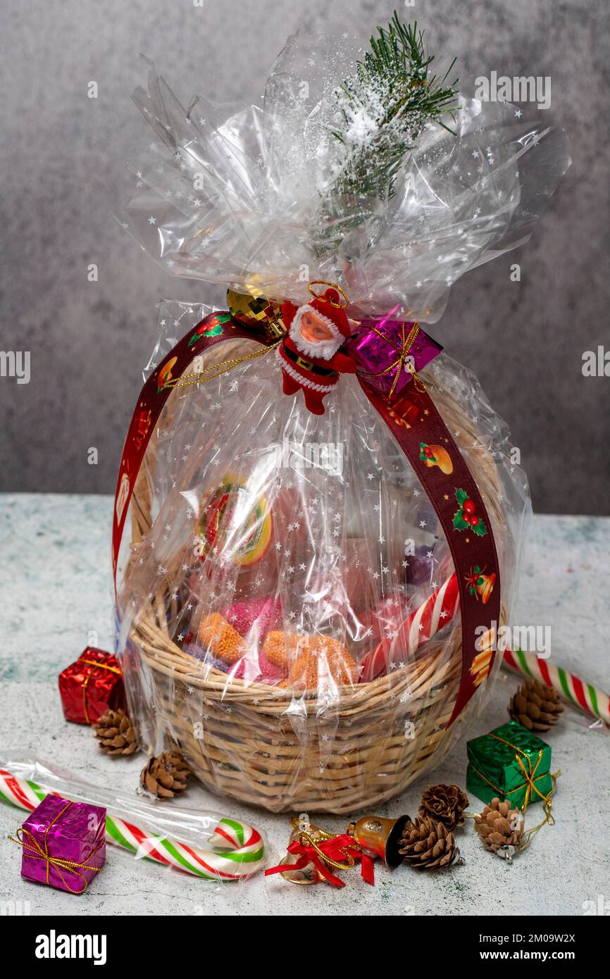 New Year gift. Christmas gift with basket on gray background. Package ...