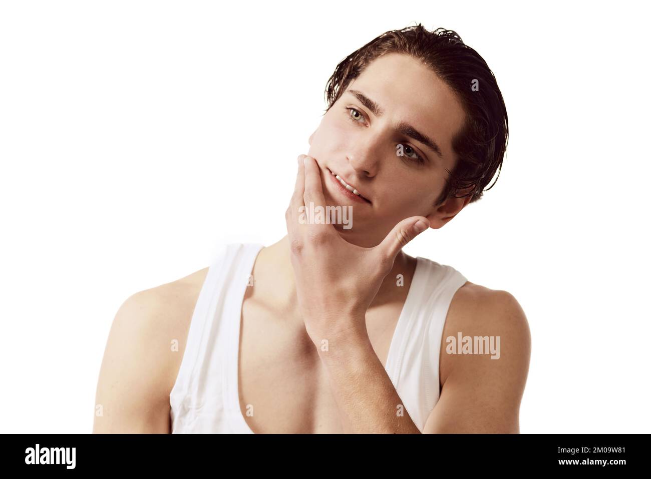 Portrait of young man after face shaving isolated over white background ...