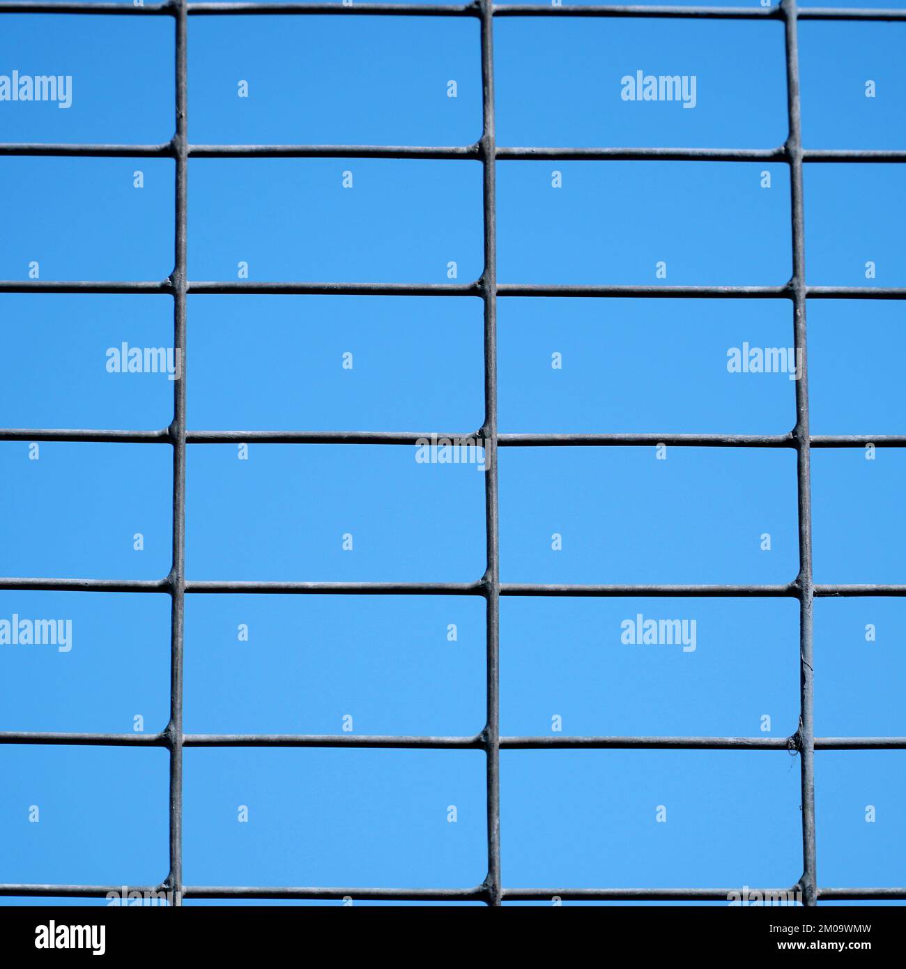 Grid with a rectangular cell on a blue sky background Stock Photo - Alamy