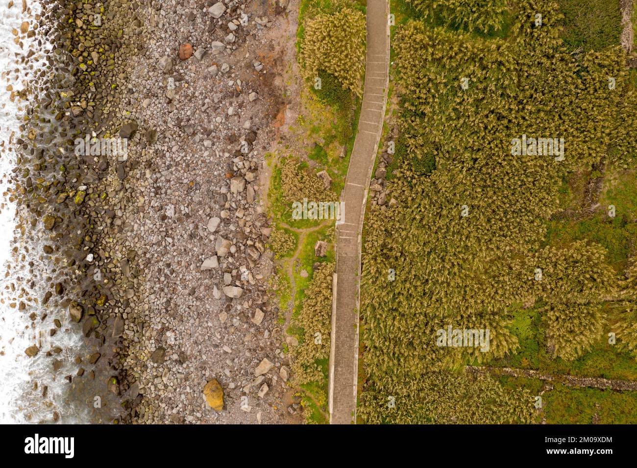 Drone view of path near ocean during summer day Stock Photo - Alamy