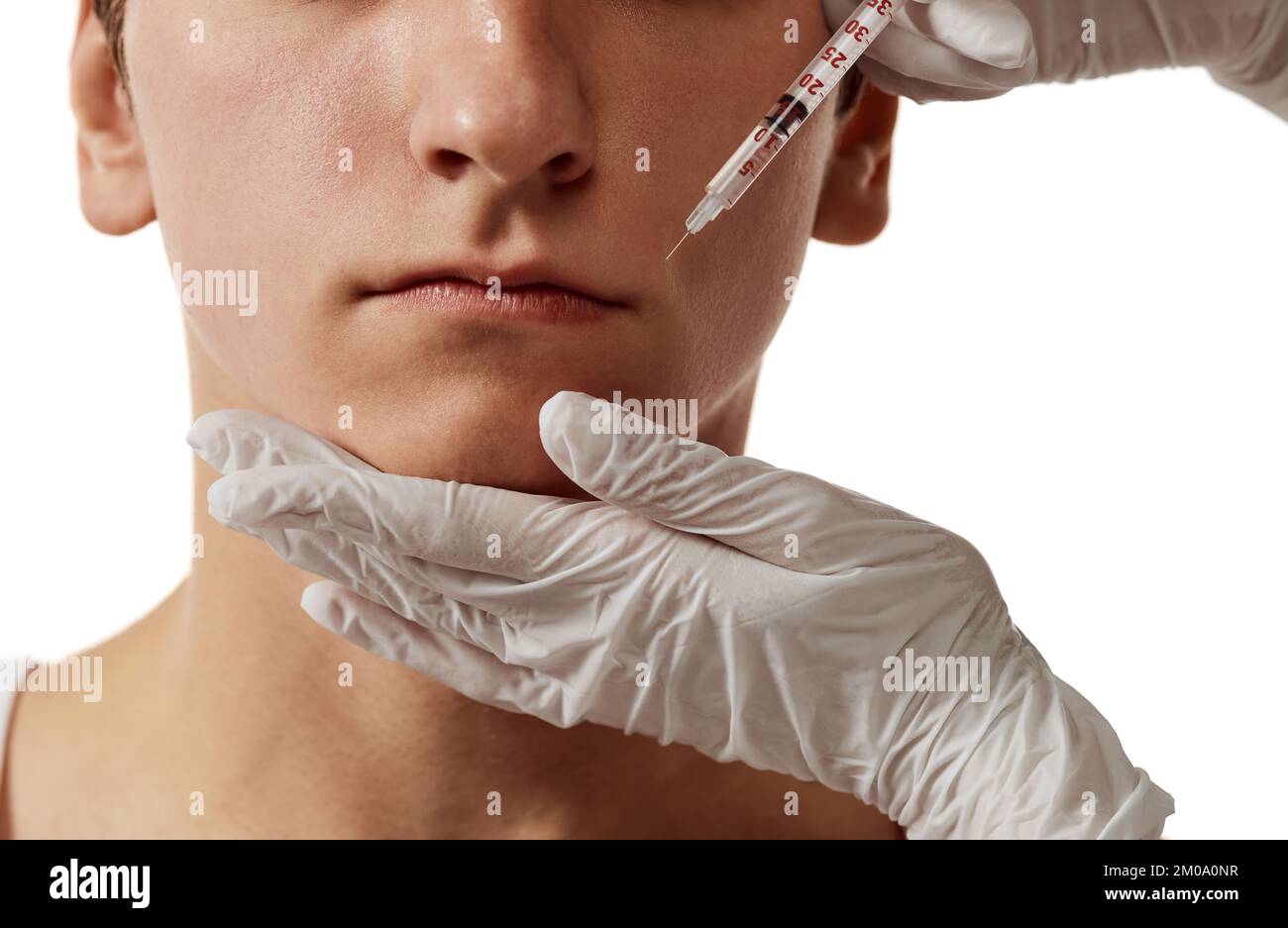Cropped image of young man, face doing beauty injections on lips, mouth ...