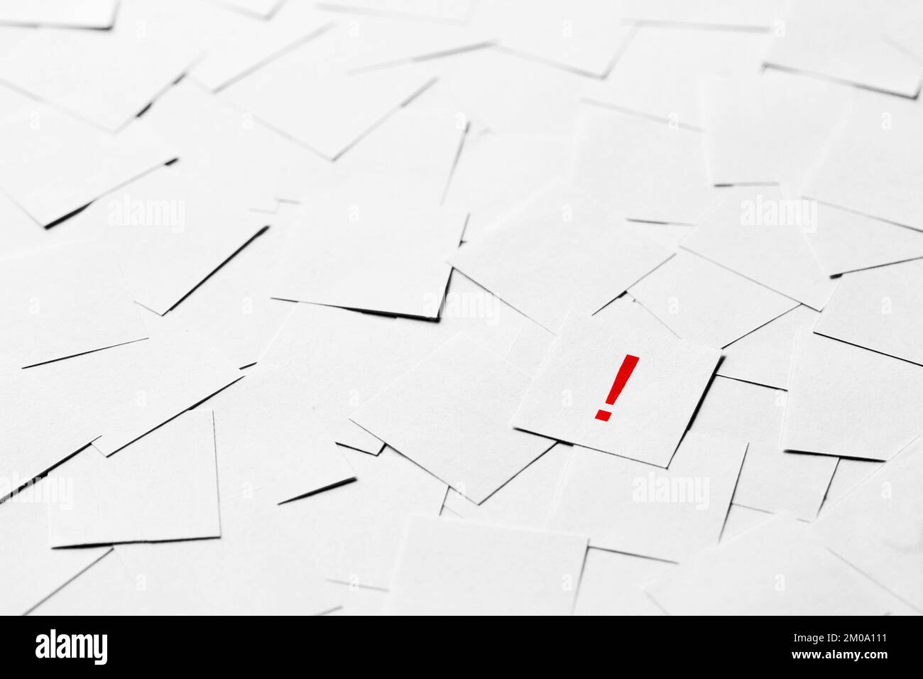 Pile of blank pieces of paper with red exclamation mark in the middle ...