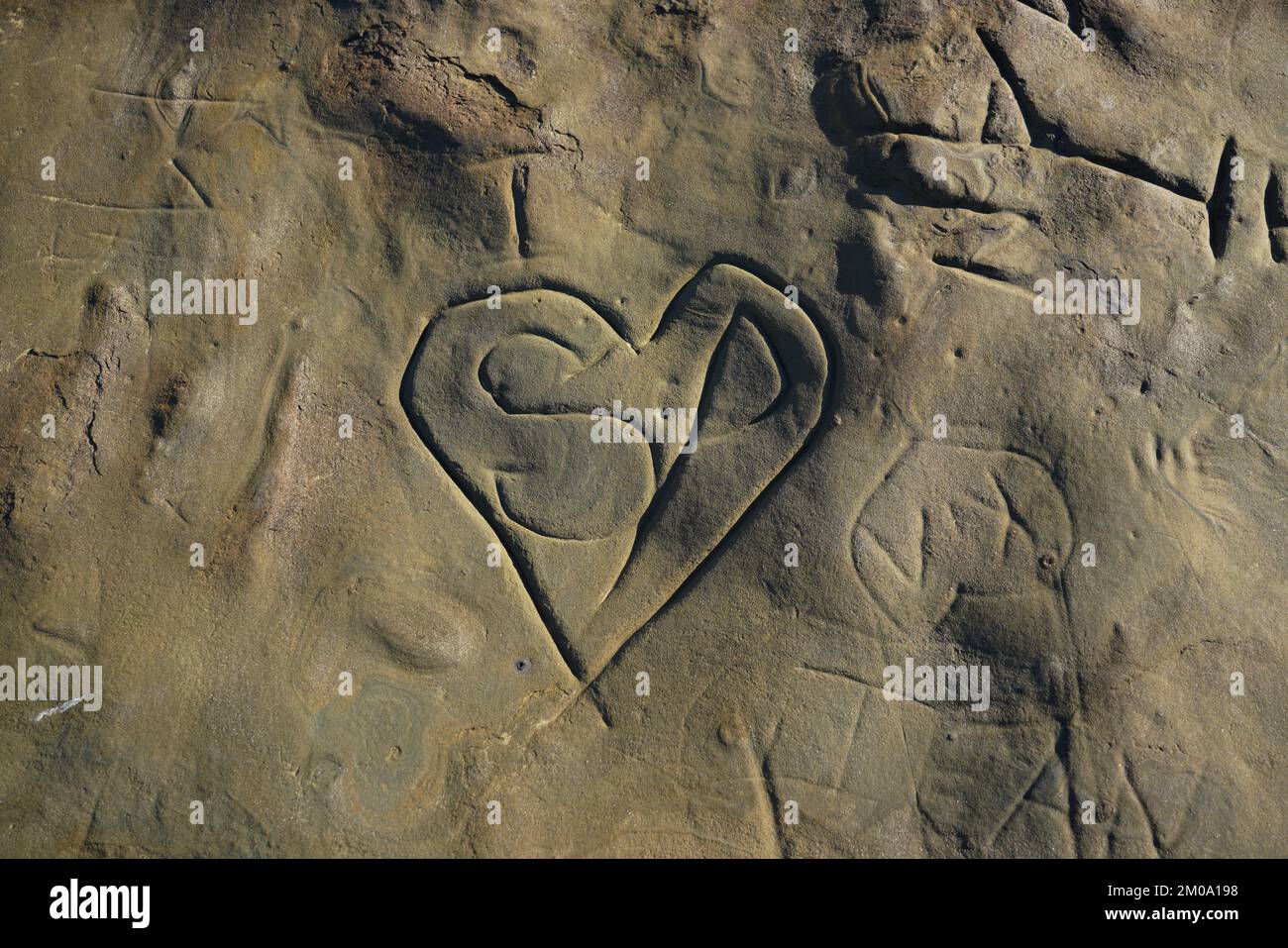 The carved initials with a heart on the stone in San Diego, California ...