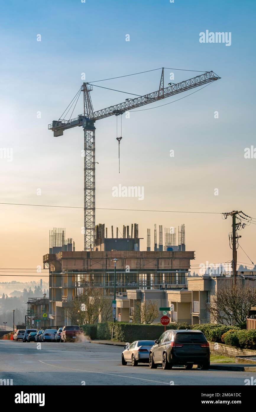New high-rise building under construction on winter morning Stock Photo ...