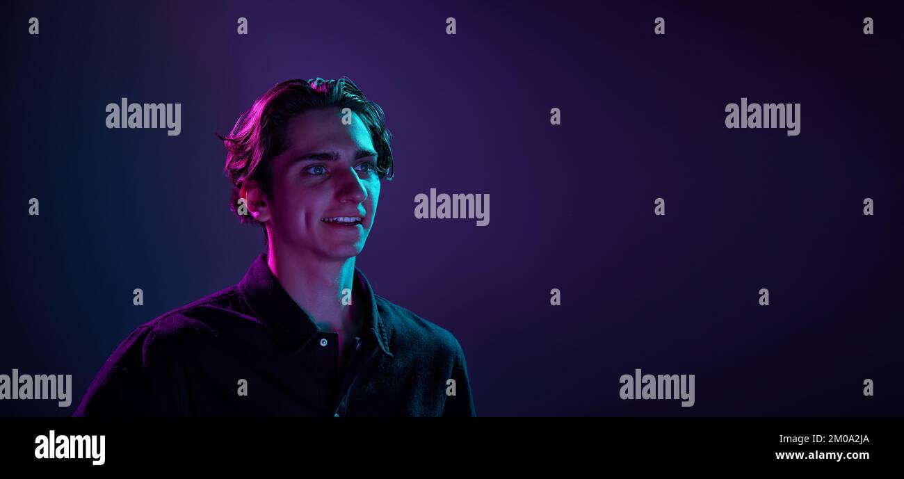 Portrait of young man in casual black shirt posing, smiling isolated ...