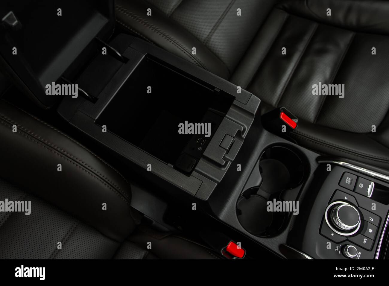 Car armrest opened. Opened armrest in the car for driver Stock Photo ...