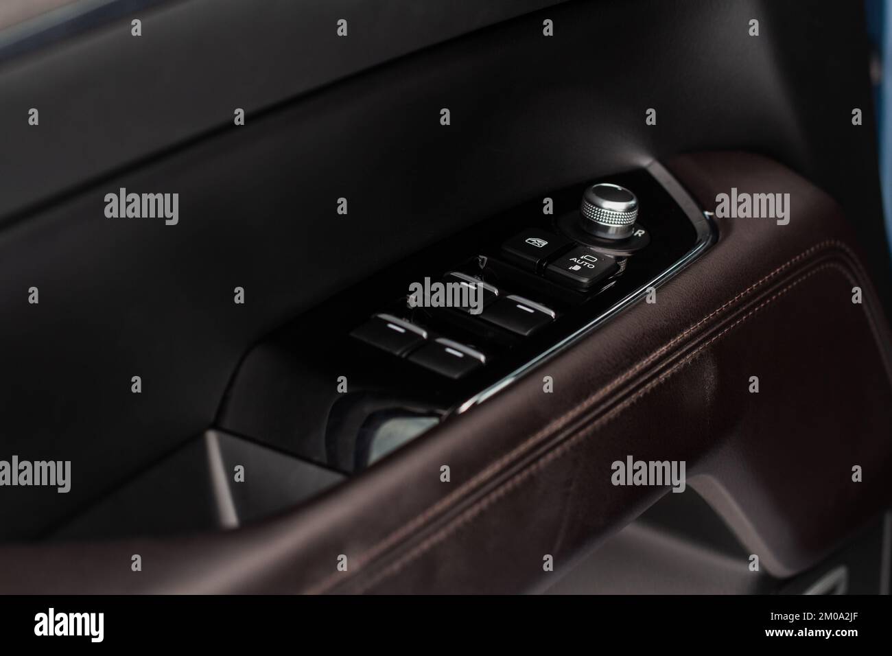 Close up view of button controlling window in modern car interior ...