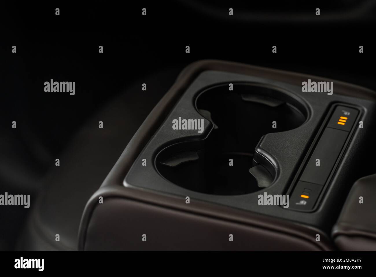 Seat heater button on the armrest, car interior Stock Photo - Alamy