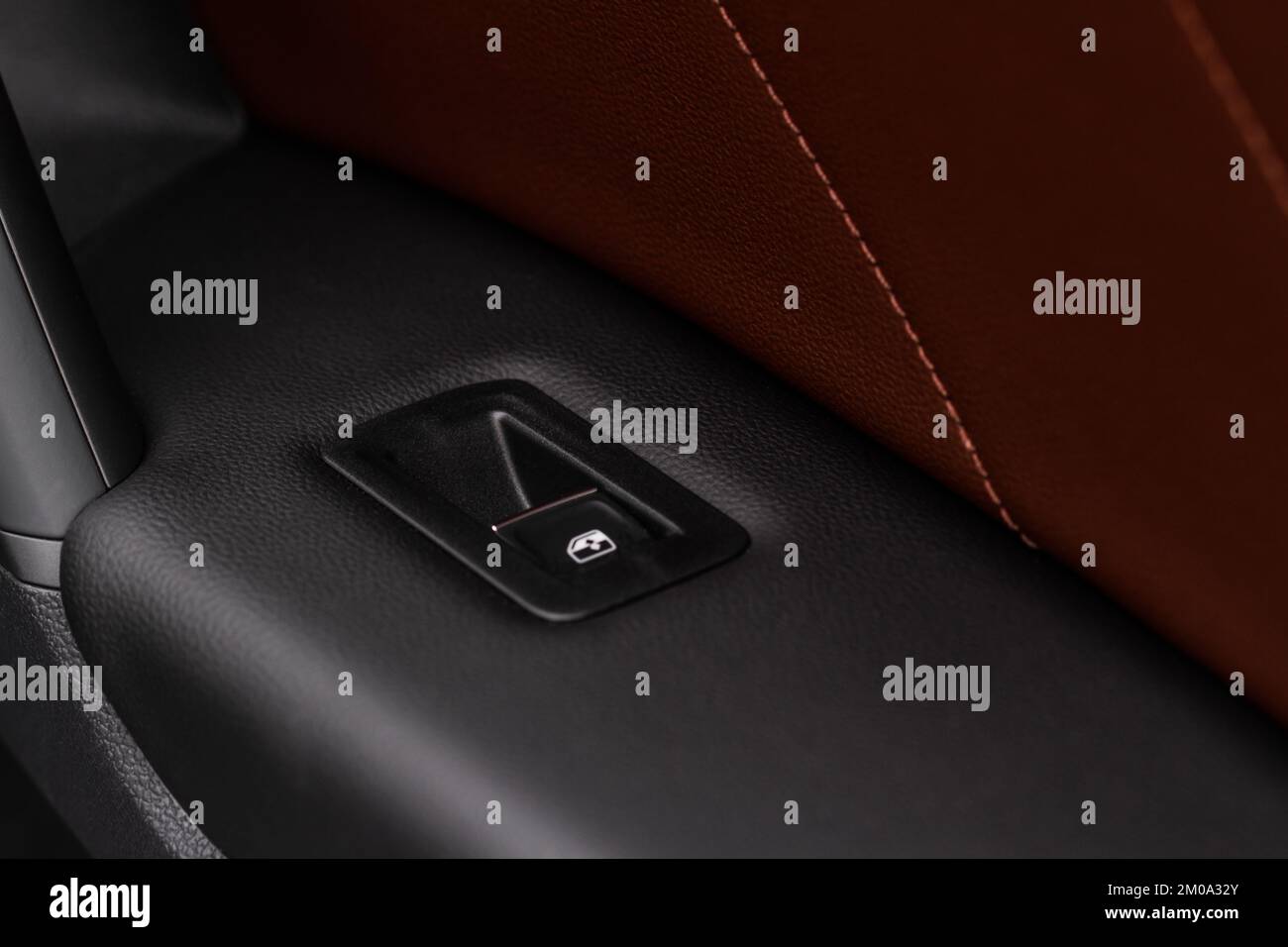 Close up view of button controlling window in modern car interior ...