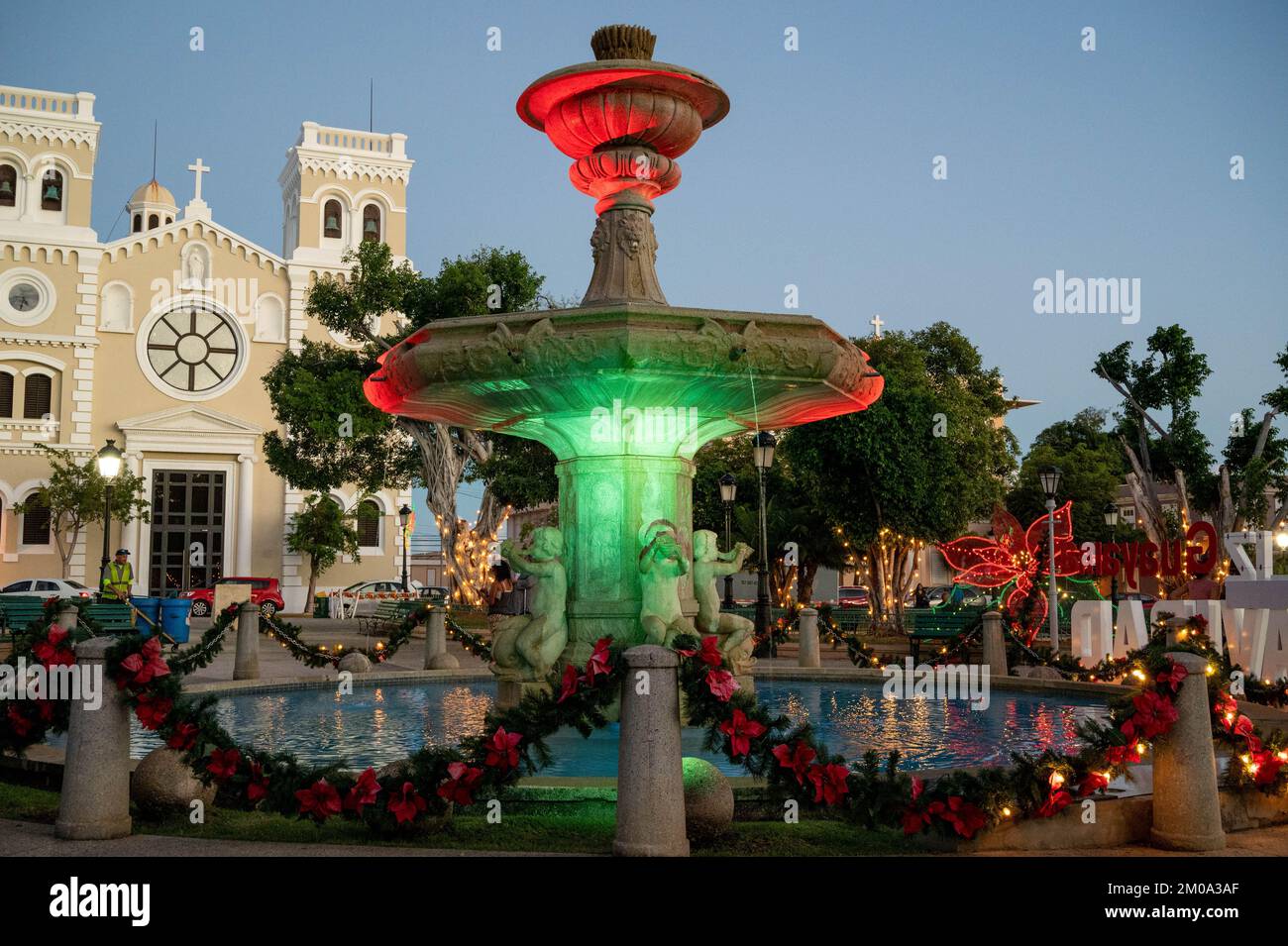 A Christmas decorated fountain in front of a church in the Guayama ...