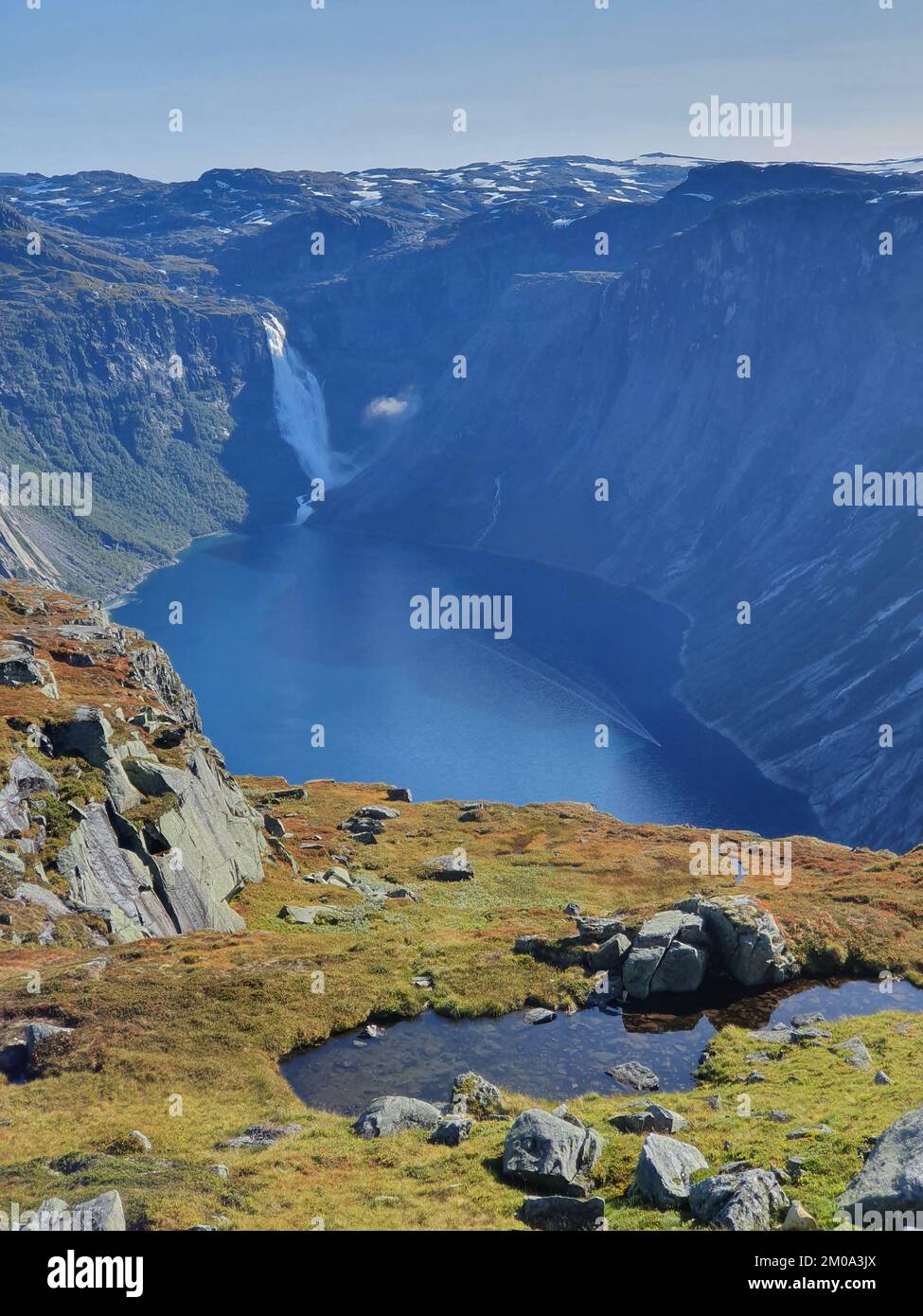 A mesmerizing waterfall and river on a sunny day in summer Stock Photo ...