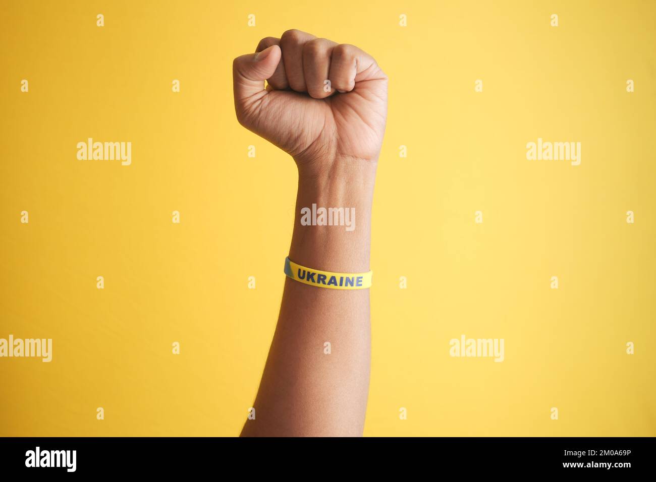 Hand with blue and yellow wristband , colors of flag of Ukraine Stock ...