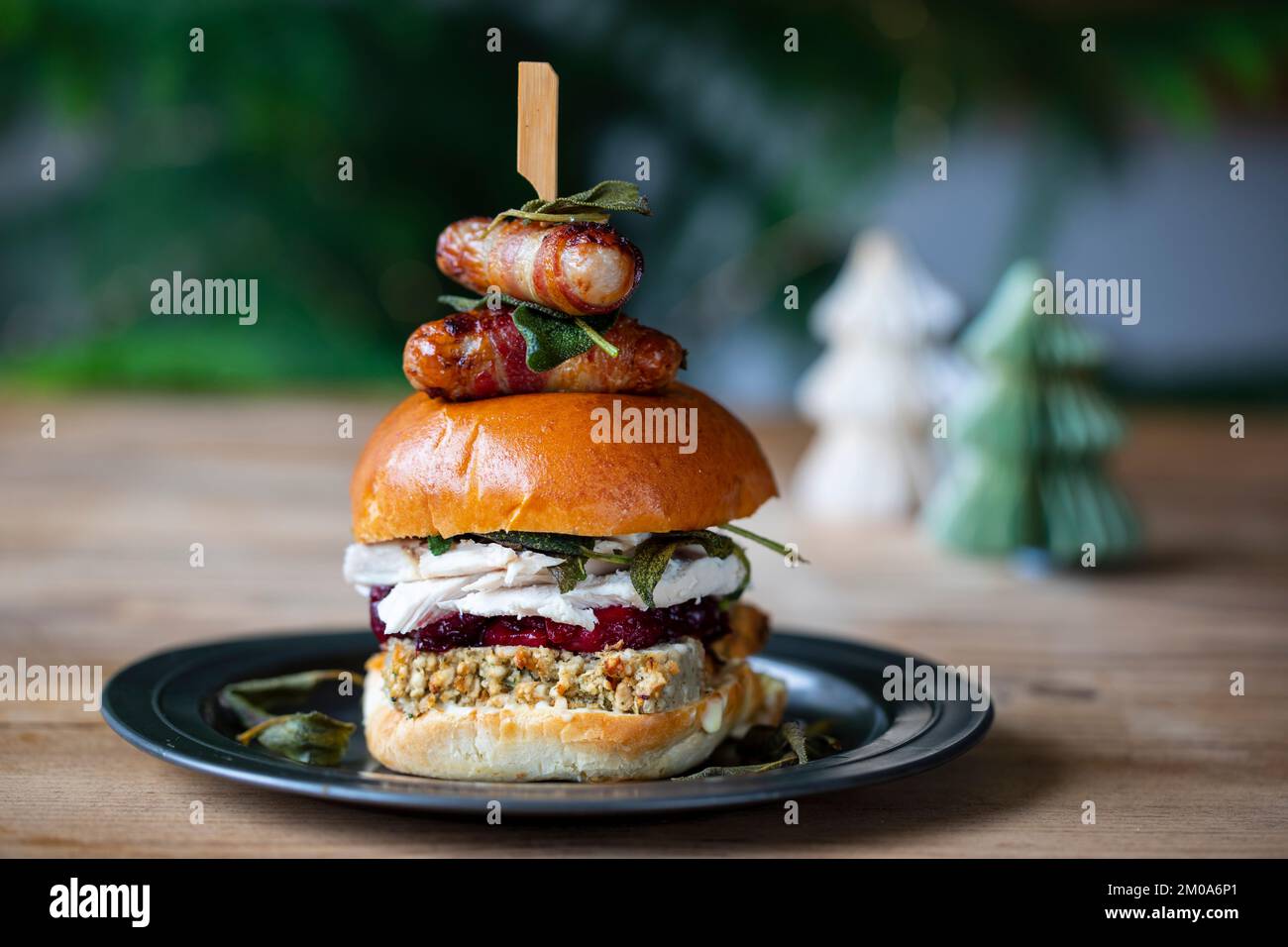 Christmas brioche bun with turkey, stuffing, cranberry sauce and pigs ...