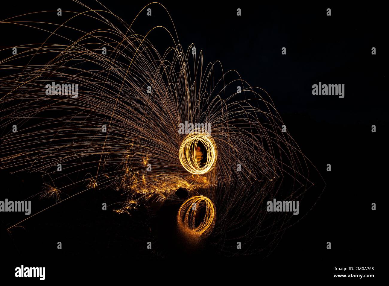 The burning steel wool on a black background Stock Photo - Alamy