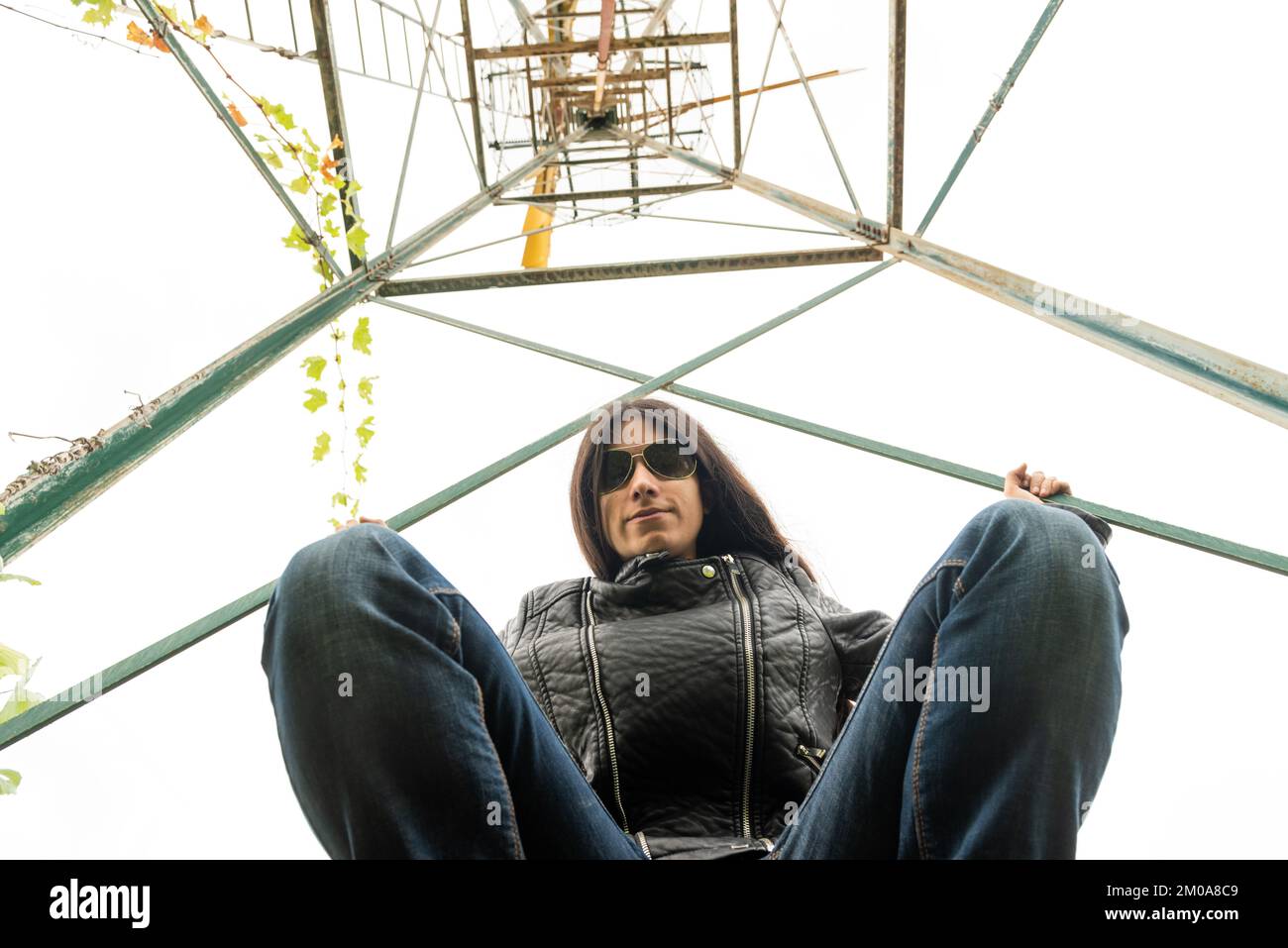 Young woman with long hair, dressed in classic fur jacket and ...