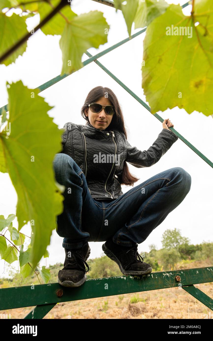 Young woman with long hair, dressed in classic fur jacket and ...