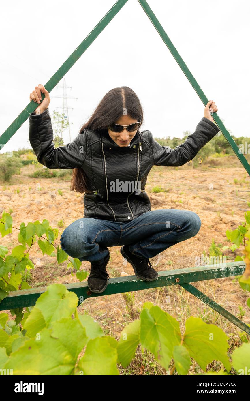 Young woman with long hair, dressed in classic fur jacket and ...
