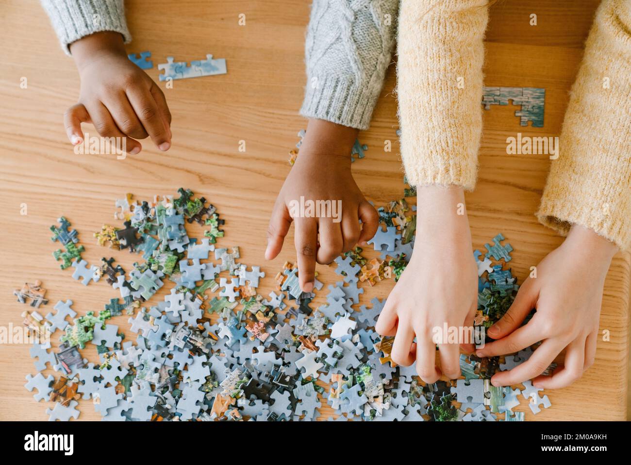 Children solving puzzles hi-res stock photography and images - Alamy