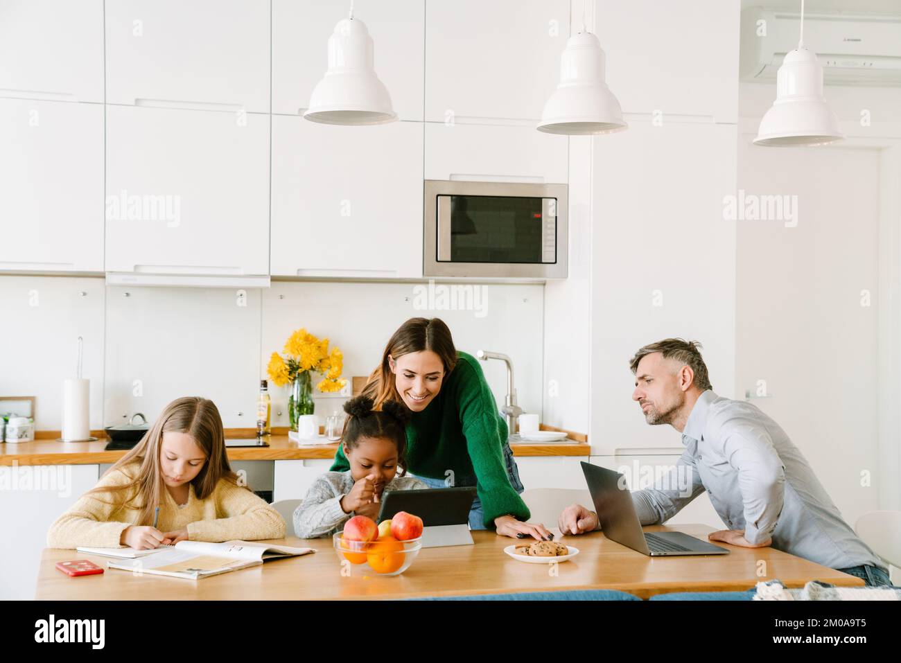 Working parents with their kids hi-res stock photography and images - Alamy