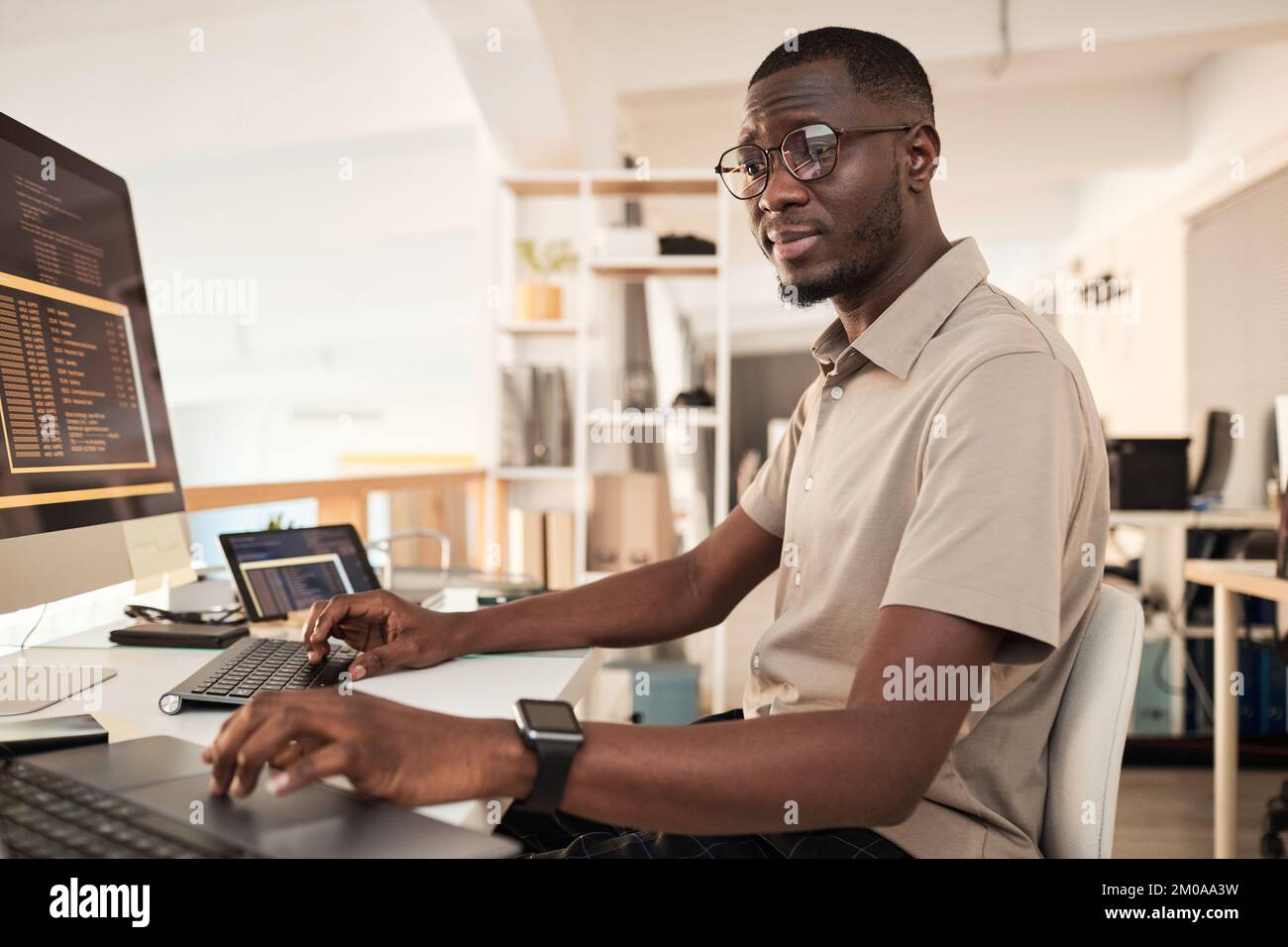 Portrait Of Black Devops Engineer Testing And Examining Code Written By
