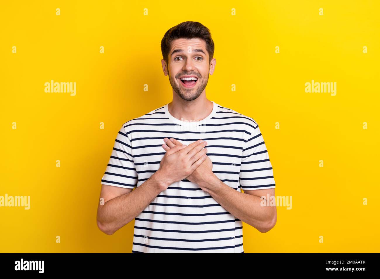 Photo of impressed cheerful young man open mouth arms touch chest ...