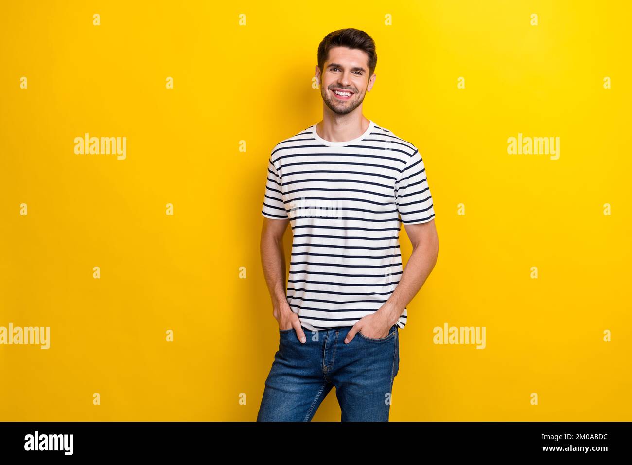 Photo of satisfied glad person beaming smile put hands pockets isolated ...