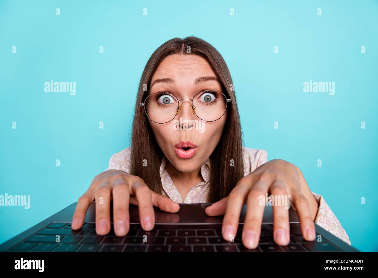 Photo of impressed millennial woman type keyboard wear spectacles ...