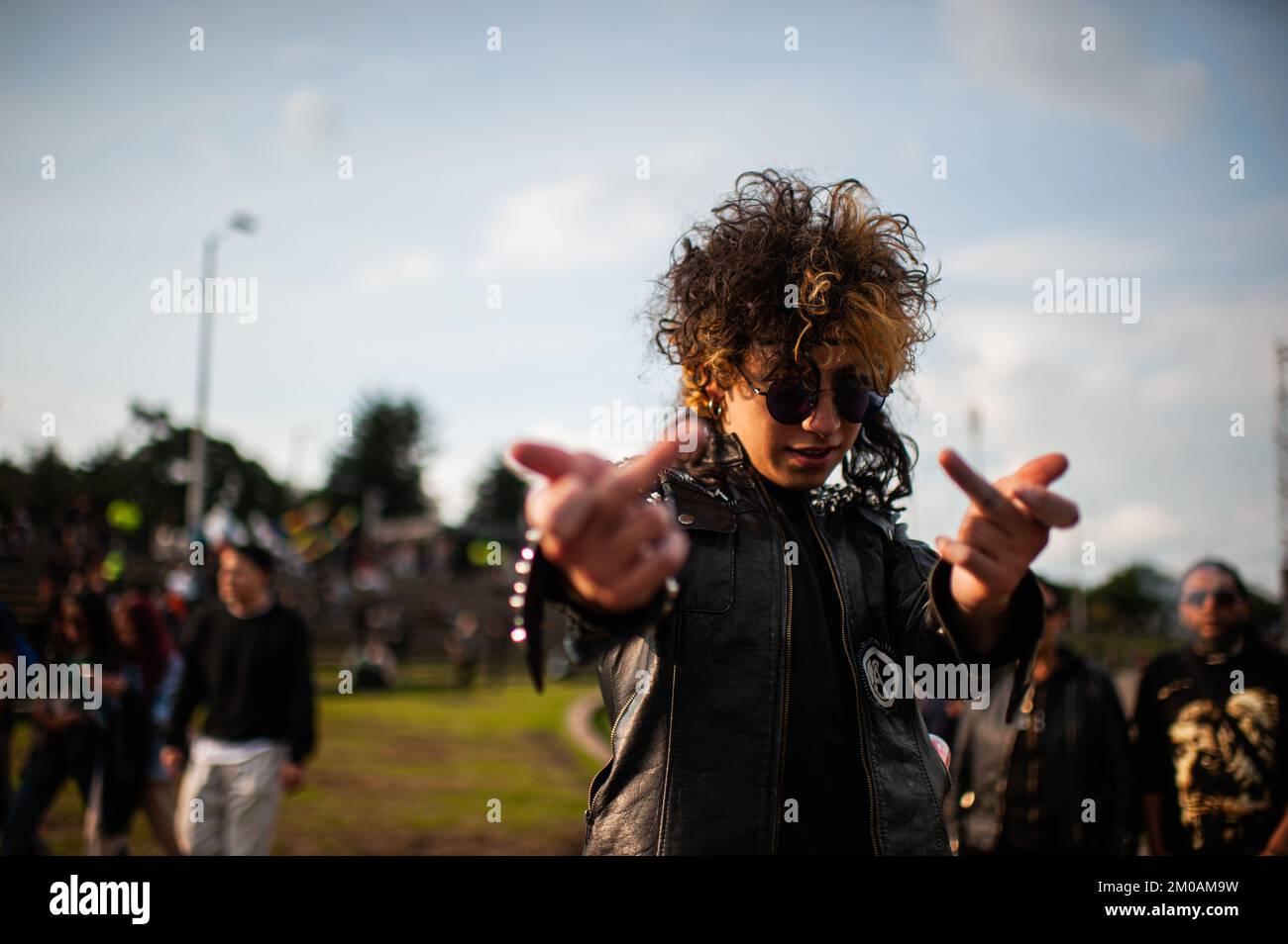 Concertgoers pose for a portrait during the third day of the comeback ...