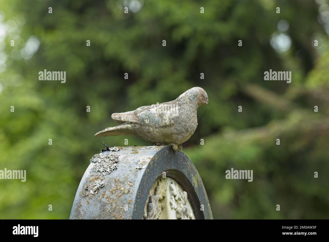 Sculpture of an bird in cemetery Stock Photo - Alamy