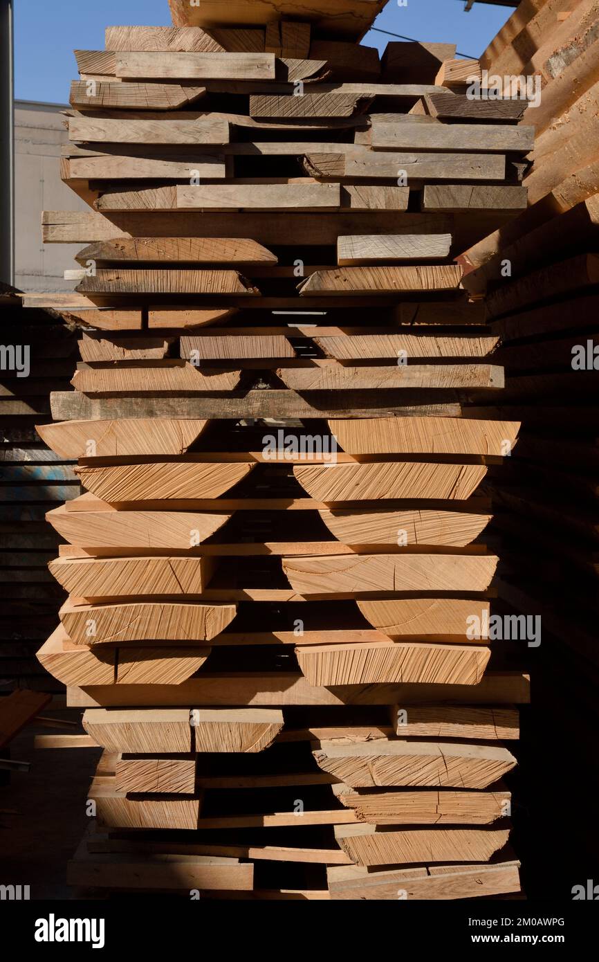 wood boards piled up in the warehouse of a carpentry Stock Photo - Alamy