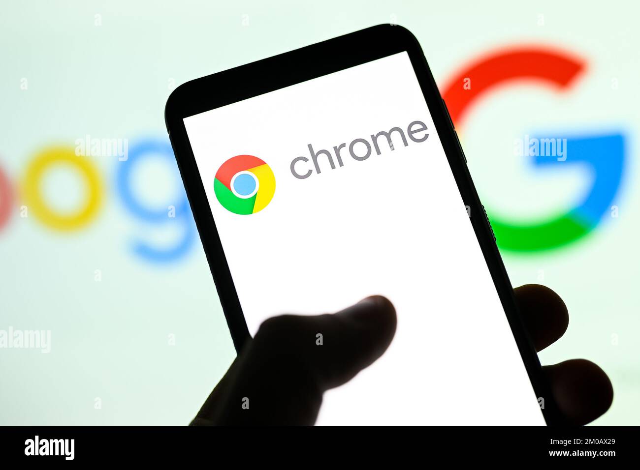 In this photo illustration a Chrome logo seen displayed on a smartphone ...